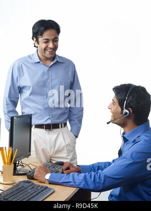 Call center, laptop and men in office with customer service for ...
