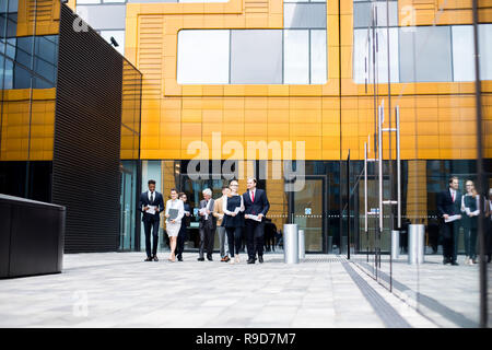 Colleagues walking after business conference in La Defense Paris Stock ...