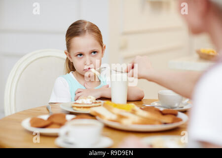 The kid girl is refusing to eat Stock Photo - Alamy