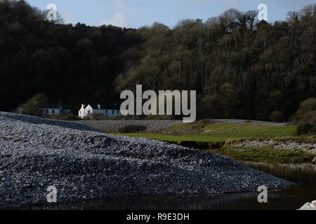The valley at Pwlldu Bay with pebble bank at the high tide mark, south ...