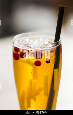 Cold lemonade with cranberries, ginger and ice on the outdoor veranda ...