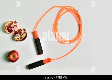jumping rope and fruit isolated on white background Stock Photo - Alamy
