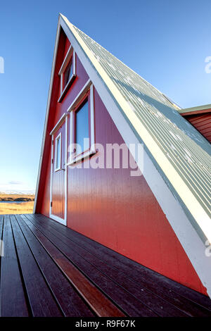 Cute triangle little house cabin red Iceland Icelandic Stock Photo - Alamy