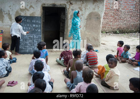 Varanasi / India 20 September 2011 Indian rural village women studying ...