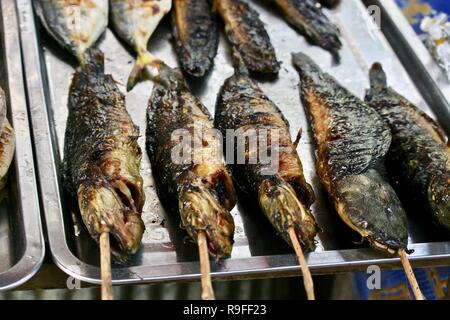 skewered, grilled snake head fish Stock Photo - Alamy