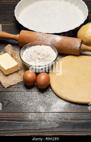 rolled and unbaked Shortcrust pastry dough recipe on wooden background ...