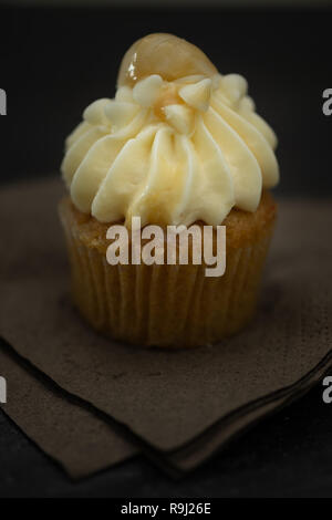 Tasty mini cupcakes on a vintage background, sweet dessert for ...