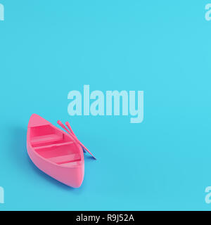 Pink canoe with paddles on bright blue background in pastel colors ...