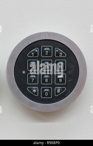 vertical photo of a closed padlock and a computer keyboard with blue ...