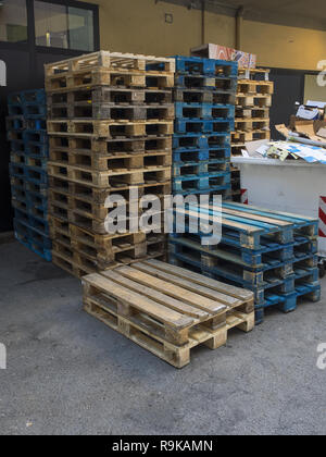 group of old wooden pallet stacked outside wharehouse ready for the ...
