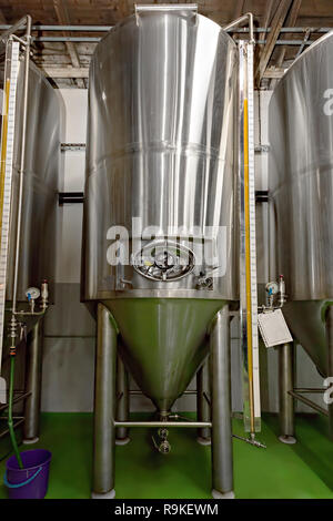 Brewery. Modern beer plant with brewering kettles, tubes and tanks made ...