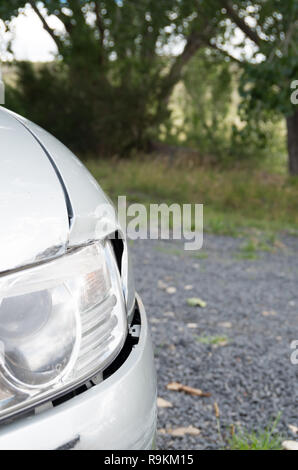 Damaged car headlight and panels after a collision in wet weather Stock ...
