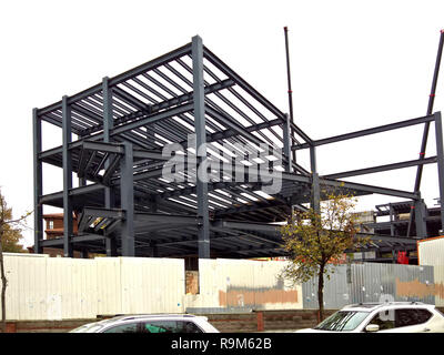 White steel frame building skeleton against blue sky Stock Photo - Alamy