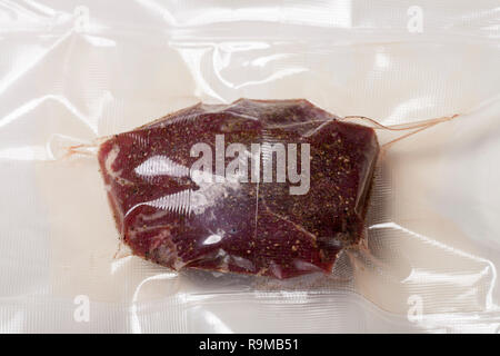 Sous vide cooker and vacuum packed food products in box isolated on ...