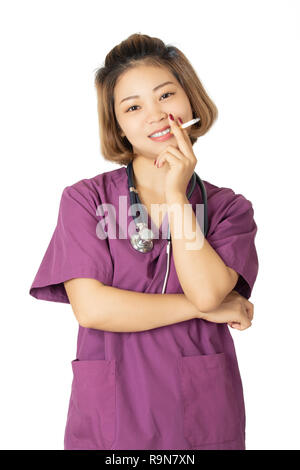 Beautiful Asian doctor or nurse smoking a cigarette isolated on a white ...