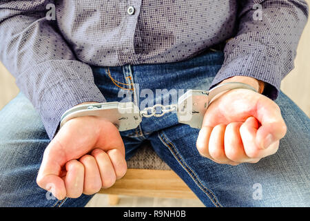 Man with chains on his wrists Stock Photo - Alamy