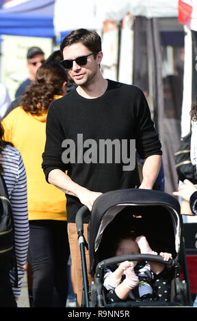 Topher Grace goes to the farmers market with his wife Ashley and ...