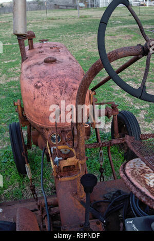 Old rusty red iron farmer's tractor Stock Photo - Alamy
