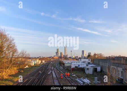 Changing skyline of Woking, Surrey: railway tracks lead to tower cranes ...