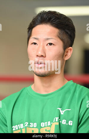 Takuma Inoue (C) of Japan talks to media with his trainer and father ...