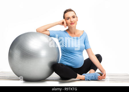 Pregnant woman, lotus and exercise ball with white background for ...