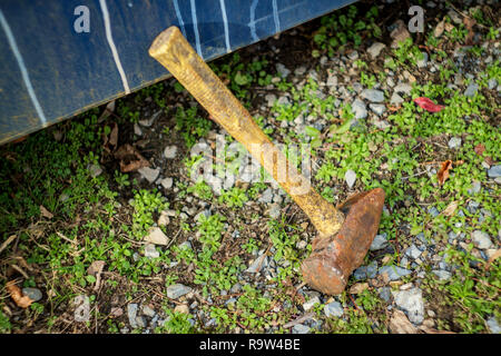 Small single handed worn and rusty sledge hammer construction ...