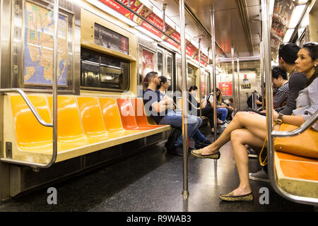 View of passengers inside subway train in Manhattan, New York City ...