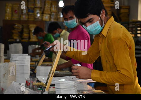 Pakistani leather industry workers workingin football factory Stock ...
