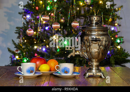 Christmas background with gifts and Christmas tree tea cup fruit Stock ...