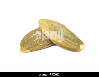 Two pumpkin seeds without shell on white background Stock Photo - Alamy