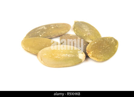 Several pumpkin seeds without the shell on white background Stock Photo ...