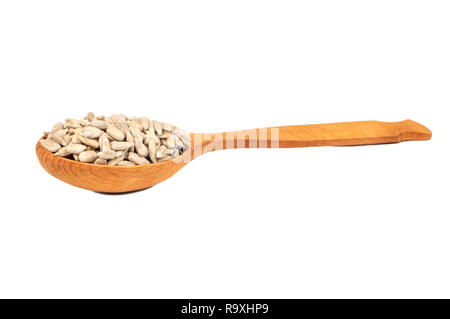 Sunflower seeds without shell in spoon closeup on white background ...