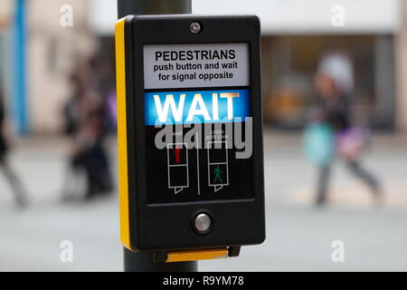 Pedestrian Wait sign at Pelican crossing in both English and Welsh ...