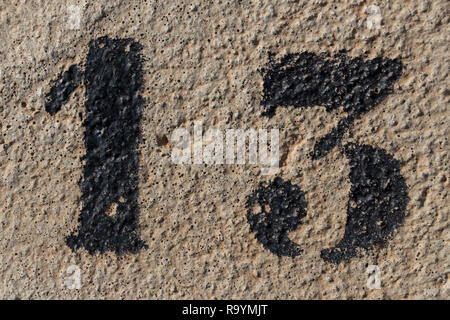 number thirteen painted stencil on concrete wall, number 13 Stock Photo ...