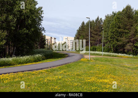Meadows, flowers and trees this side some buildings. Shadows and blue ...