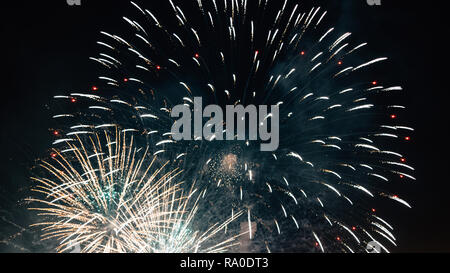 Bright fireworks in the dark night sky Stock Photo - Alamy