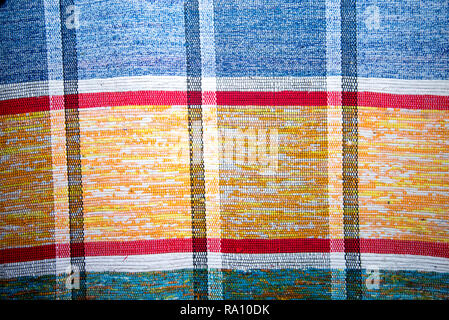 Texture of multi-colored homespun rug. Traditional rustic carpet with a ...