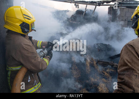 Fire crew attending a barn fire, Cumbria, UK Stock Photo - Alamy