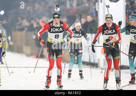 Austrian biathletes Dominik Landertinger in action during the 4 x 7.5 ...