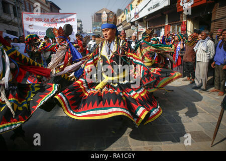 Gurung community men in traditional attire dance at a parade to mark ...