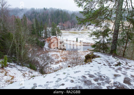 Red cliffs and river Amata at Cesis, Latvia. Winter, trees and fresh ...