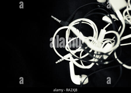 Headphone cable tangled Stock Photo - Alamy