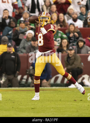 Washington Redskins quarterback Josh Johnson (8) tries to get away from ...