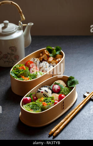 Colorful vegan bento lunch box with green vegetables and tofu Stock ...