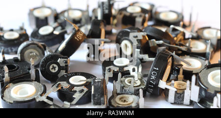 A heap of three pins, through hole, 10 KOhm small black adjustable ...