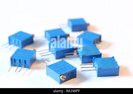 A heap of three pins, through hole, 10 KOhm small black adjustable ...