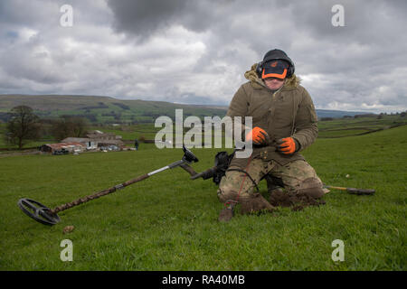 Metal detectors searching farmland in Wensleydale for metal artefacts ...