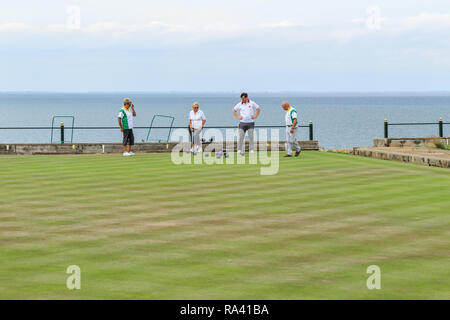 Outdoor Bowls tournament being played on a summers day, at the ...