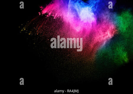 Color powder explosion cloud on black background. Freeze motion of ...