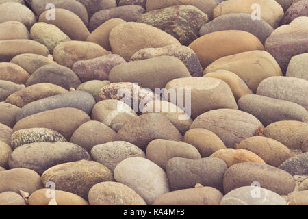 Photograph of a rounded river rocks background Stock Photo - Alamy